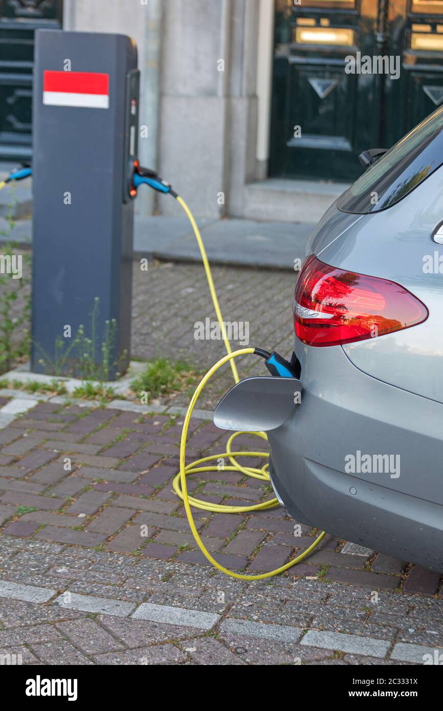 Plug in Electric Vehicle Charging at Street Power Box Stock Photo - Alamy