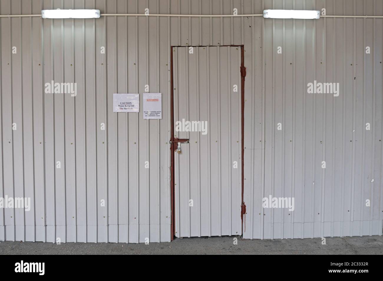 Closed Door at Construction Site White Building Stock Photo - Alamy