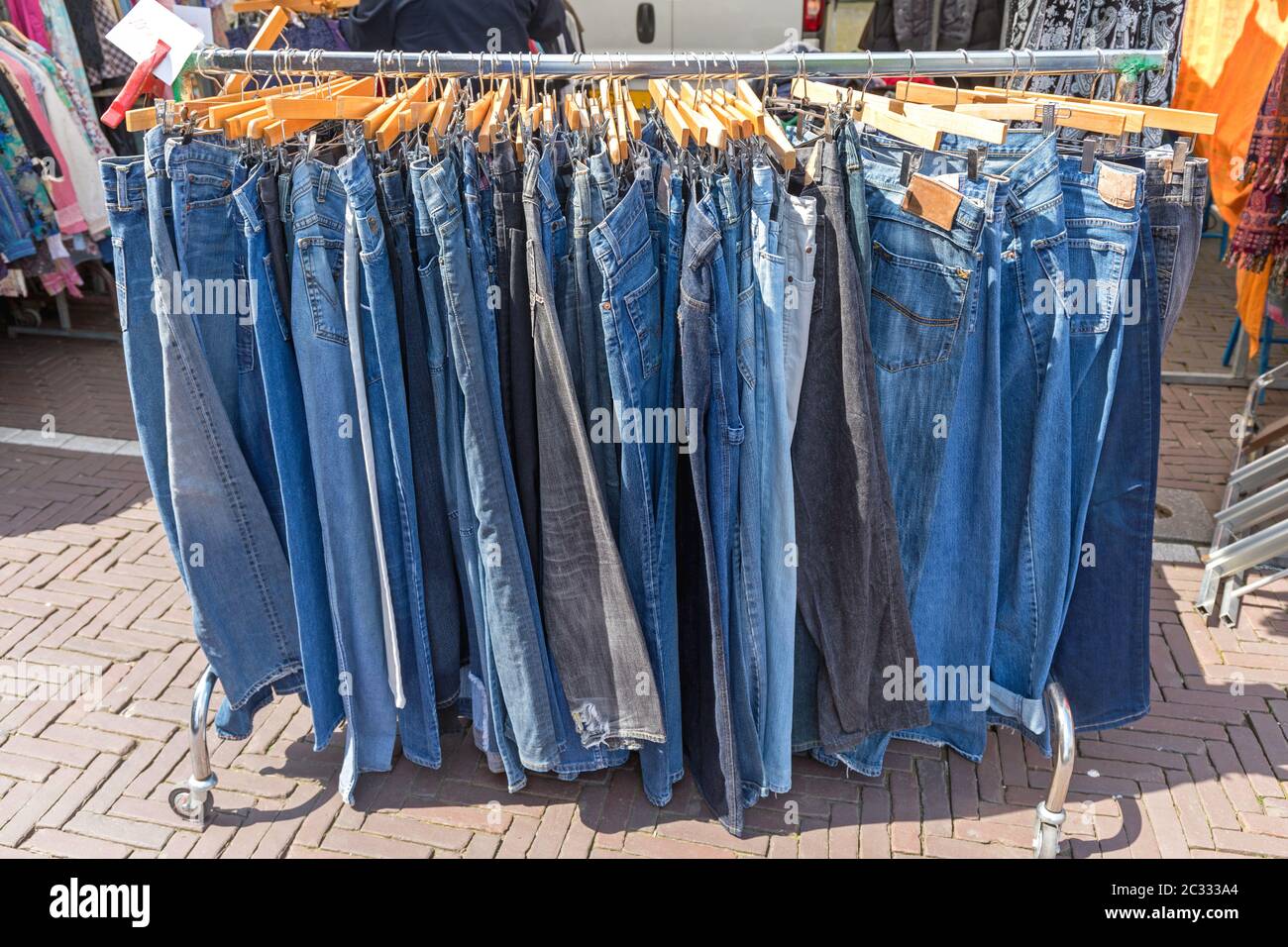 Second Hand Jeans Pants at Flea Market Stock Photo - Alamy