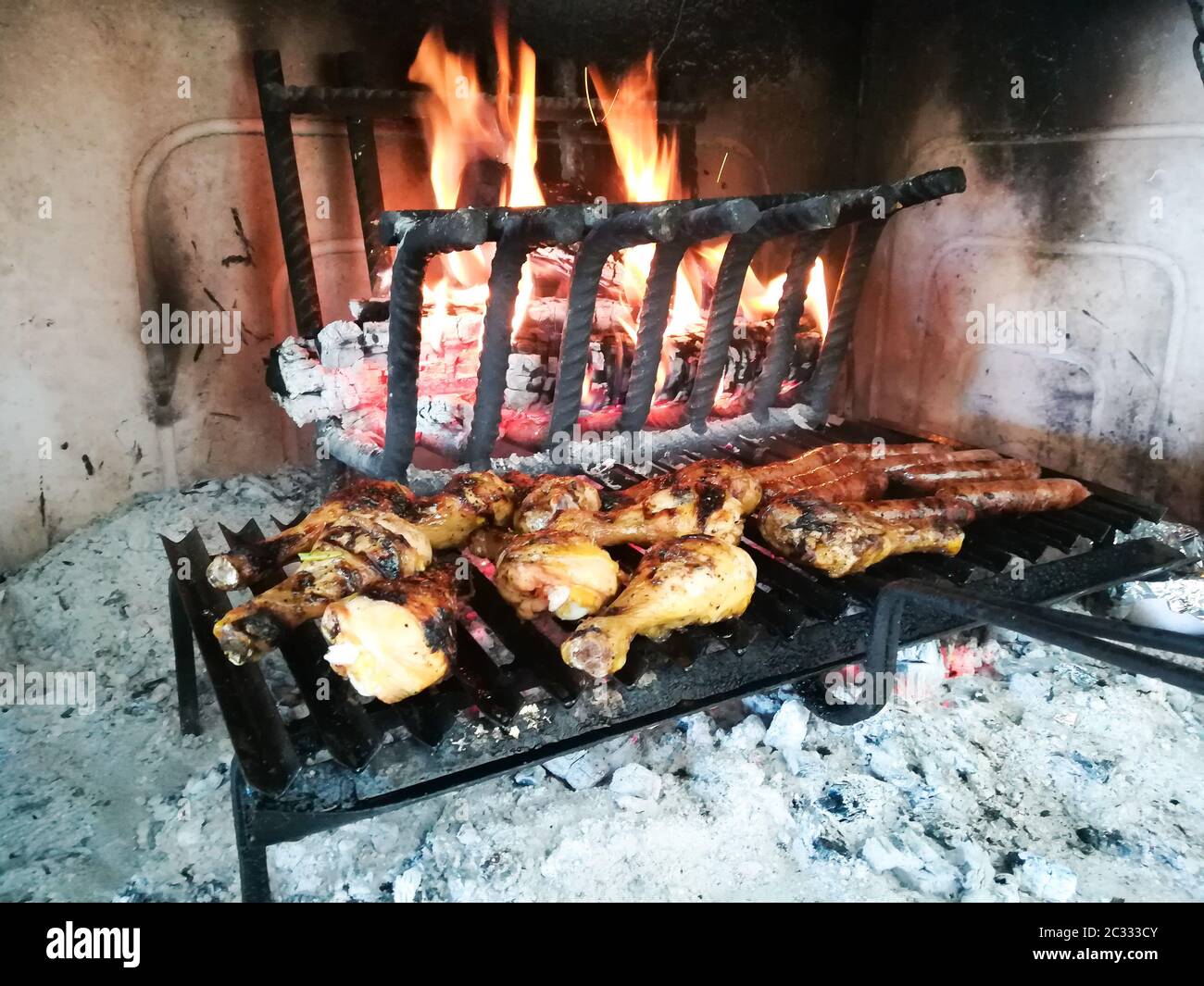 Grilled meat cooked on fireplace Stock Photo - Alamy