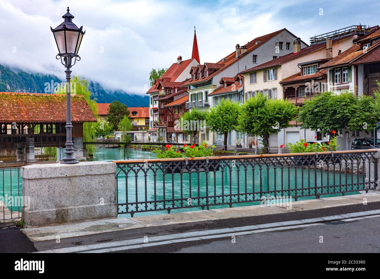 Weir and bridge on Aare river in Old City of Interlaken, important ...