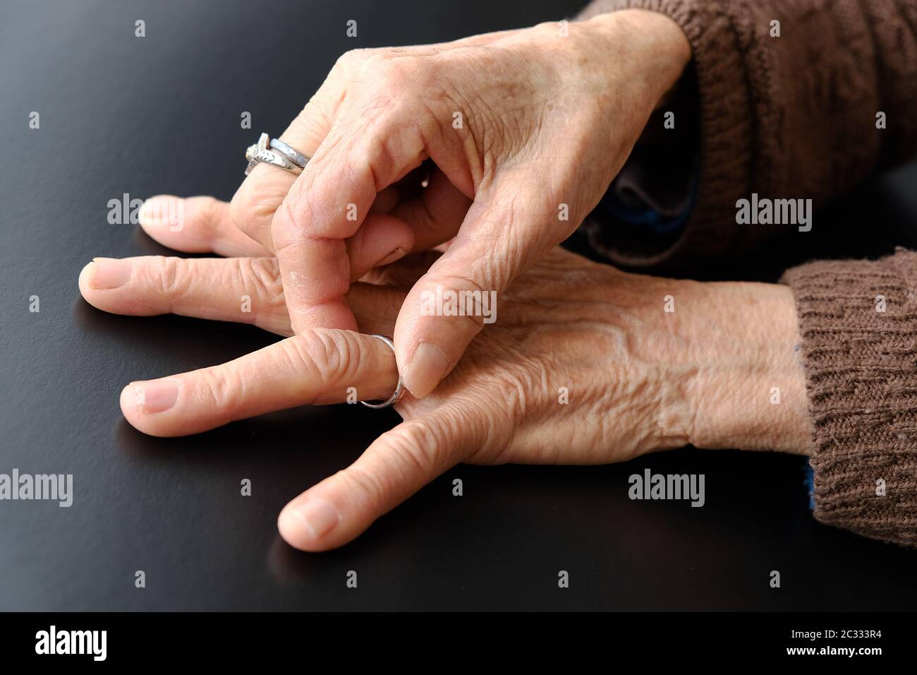 elderly woman's hand with a ring on her finger, old woman's hand and ...