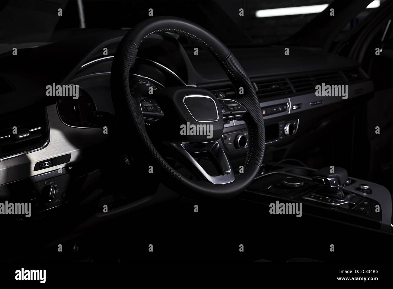 Interior of luxury suv car with black leather steering wheel and shift ...