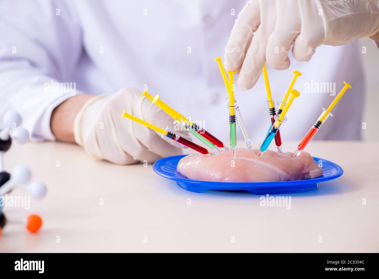 Male nutrition expert testing food products in lab Stock Photo - Alamy