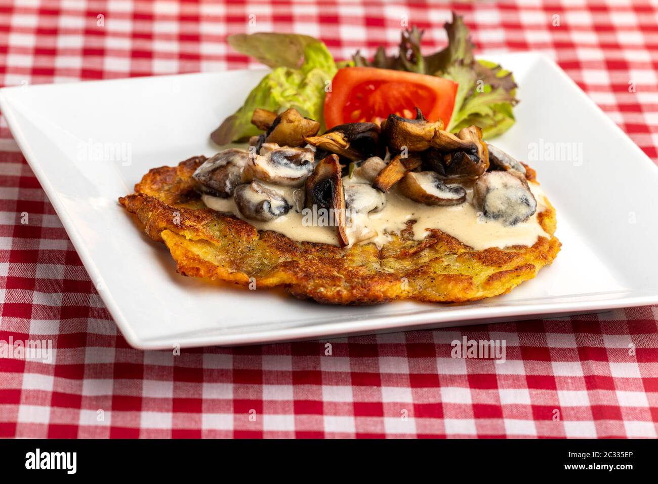 swiss roesti with mushroom sauce Stock Photo - Alamy