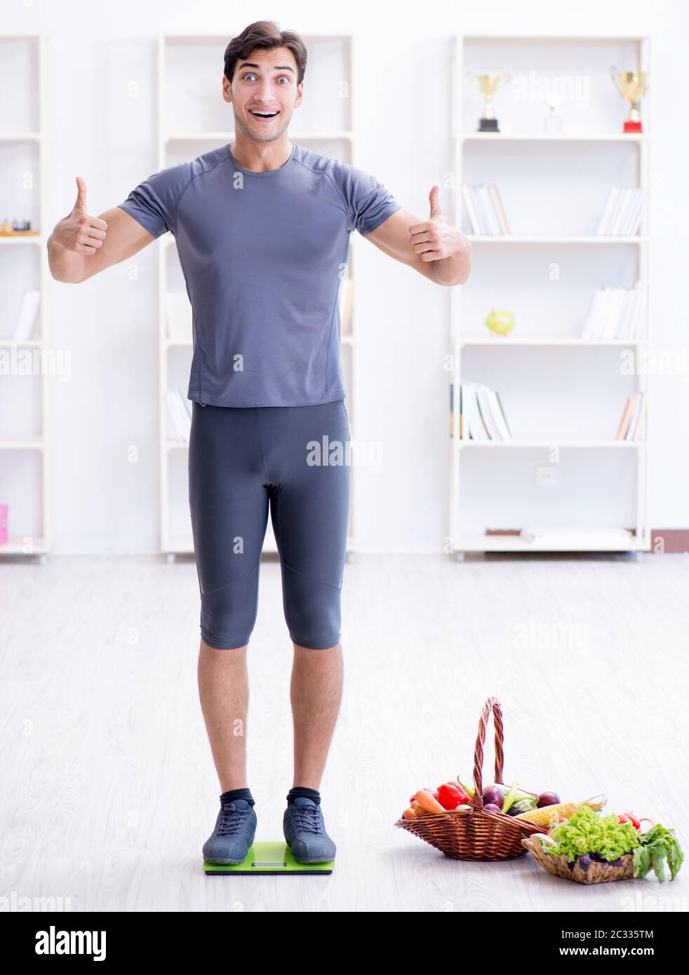 Man promoting the benefits of healthy eating and doing sports Stock ...