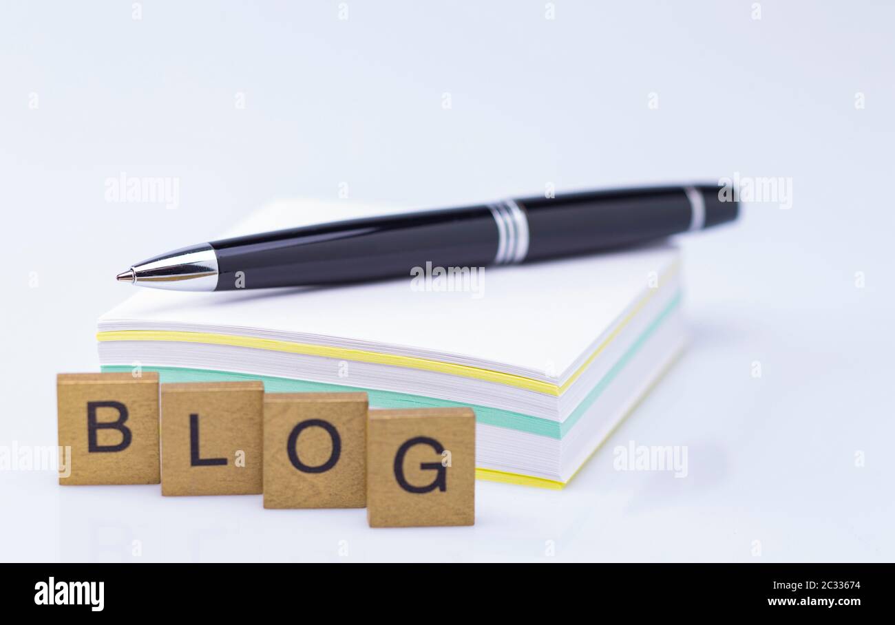 Image shows a paper stack with pen and golden wooden letters Stock ...
