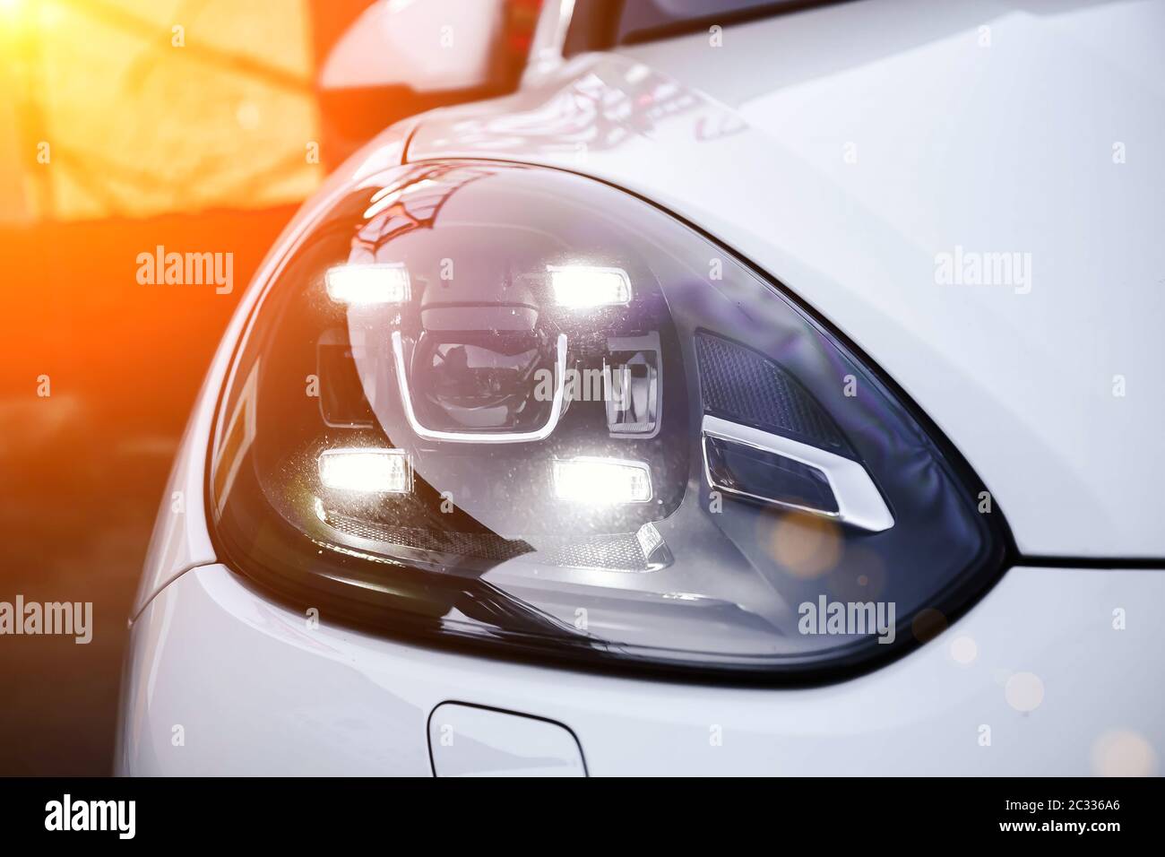 Led headlights of a white premium suv. New generation of car light ...