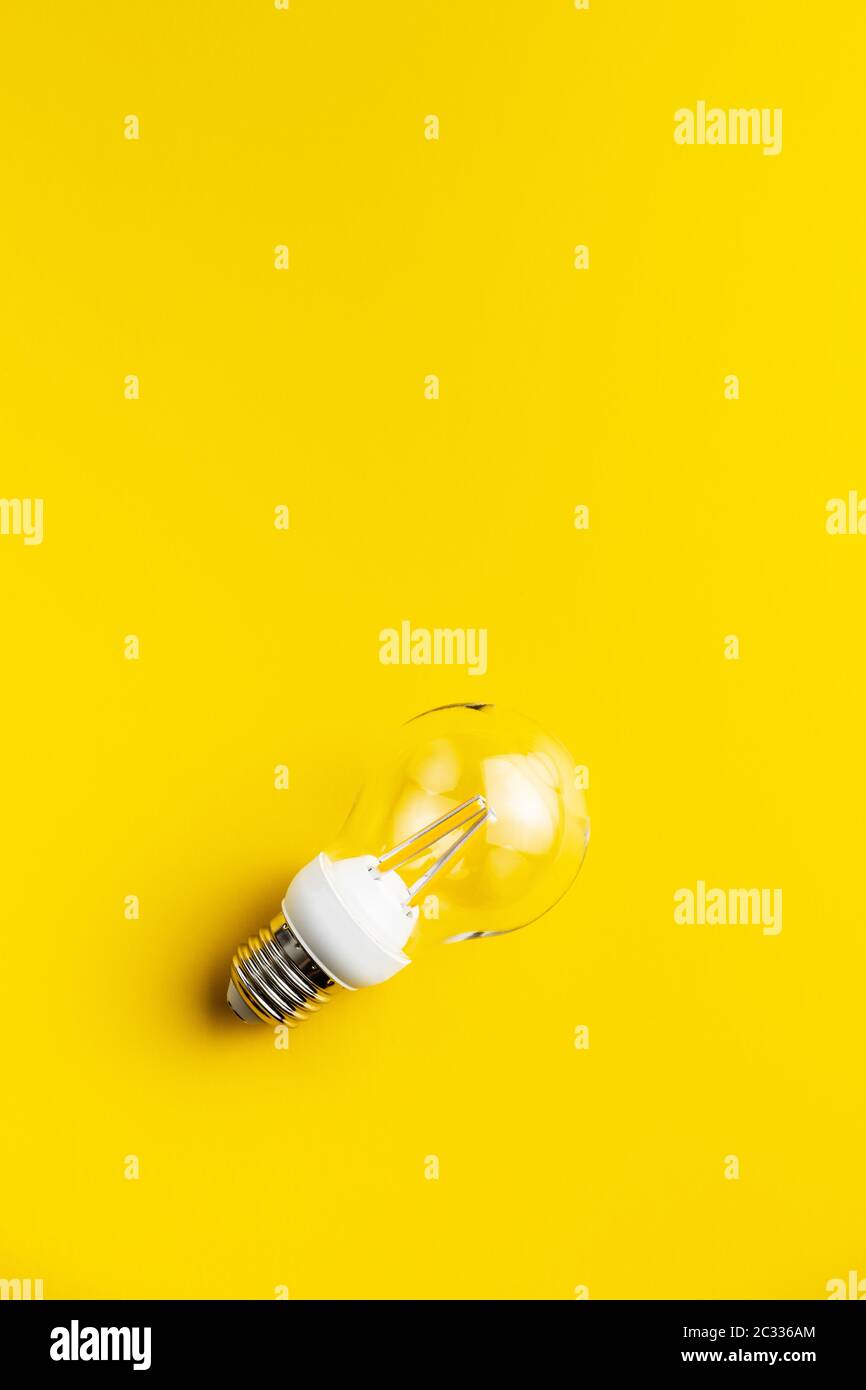Energy saving light bulb on yellow background. LED light bulb Stock ...