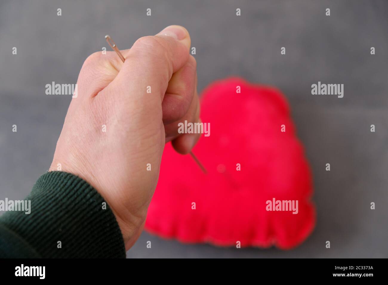 needle and heart shaped pincushion, needle and pincushion Stock Photo ...