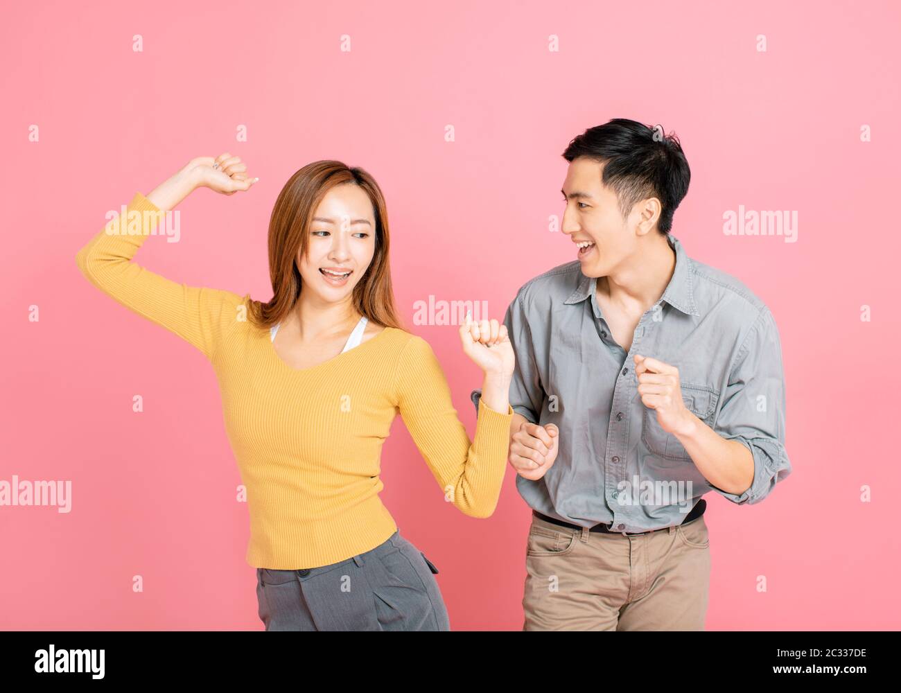 Portrait Of Happy Young Couple dancing Stock Photo - Alamy