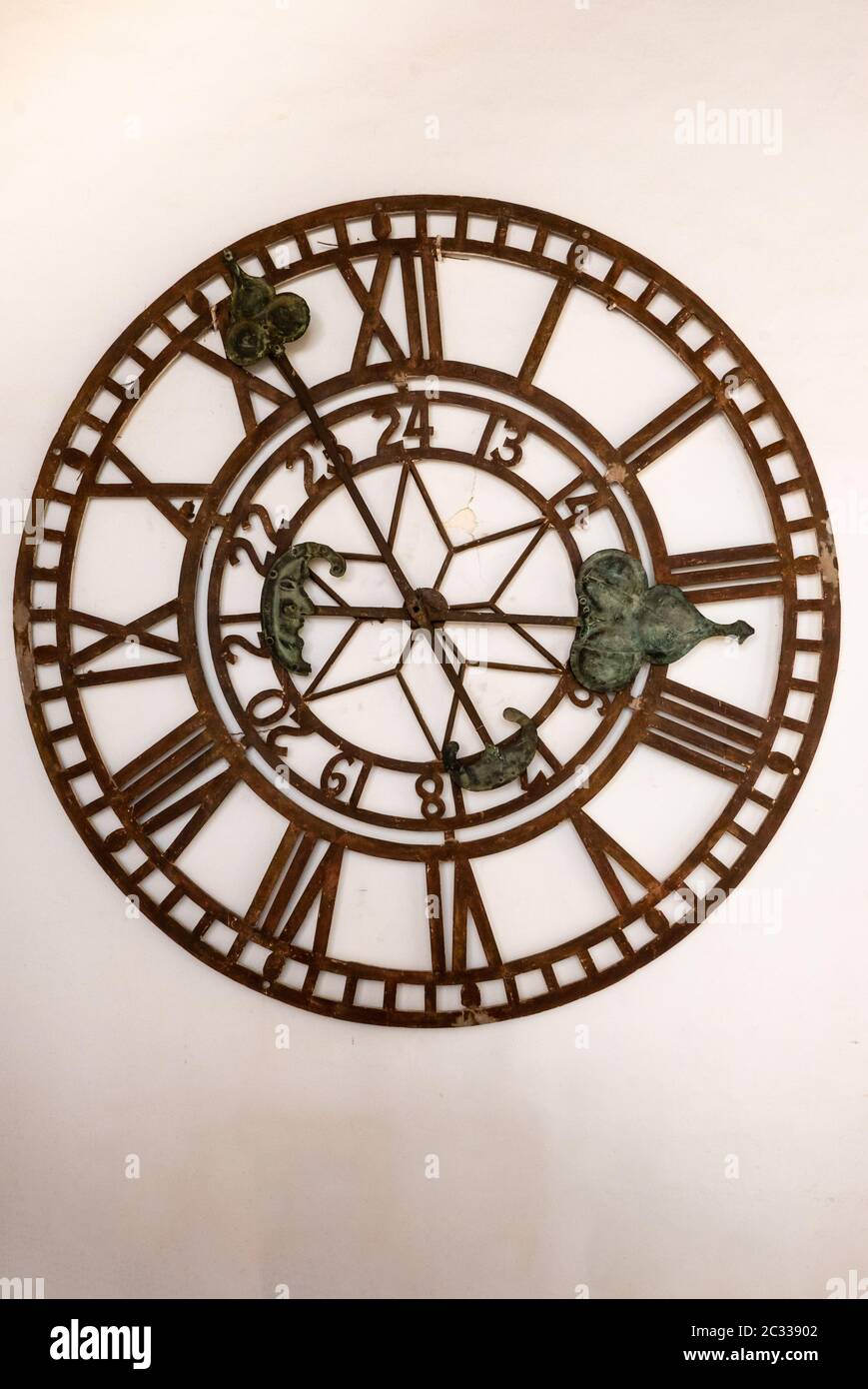 brown wrought iron wall clock Stock Photo - Alamy