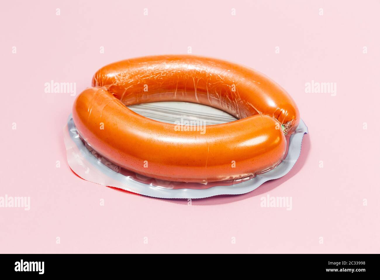Some pork sausage in plastic packaging Stock Photo - Alamy