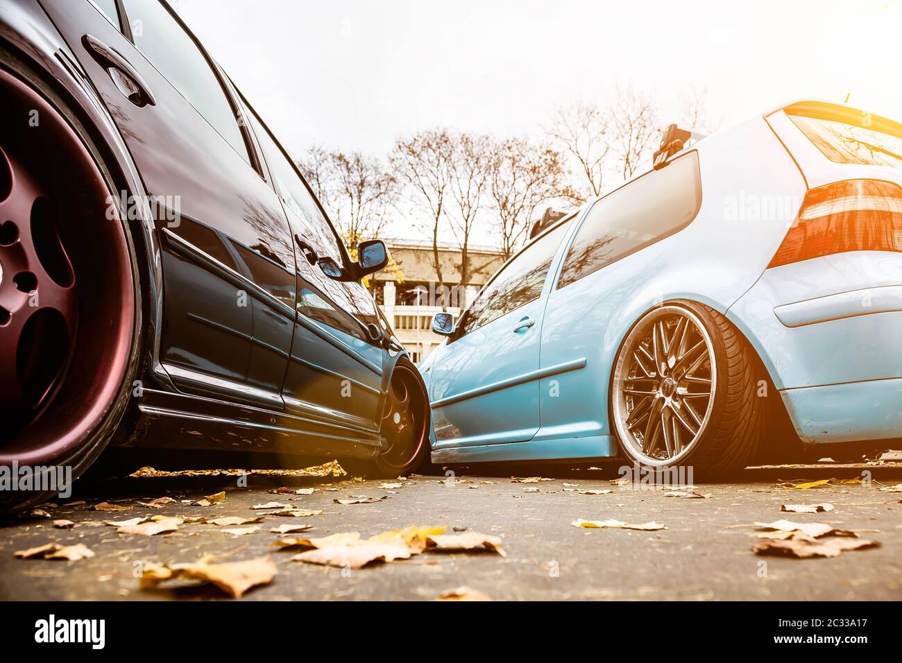 Two tuned cars. Light blue and brown collided, accident on the road ...