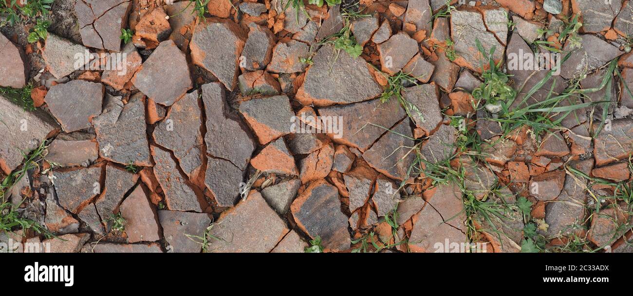 brick red debris rubble of cracked roof tiles useful as a background ...