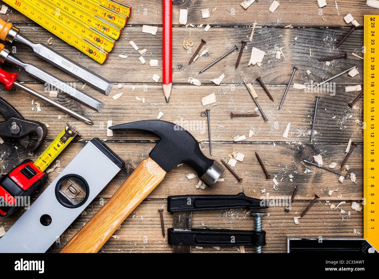 Top view of carpenter's tools on an antique wooden table. Construction ...