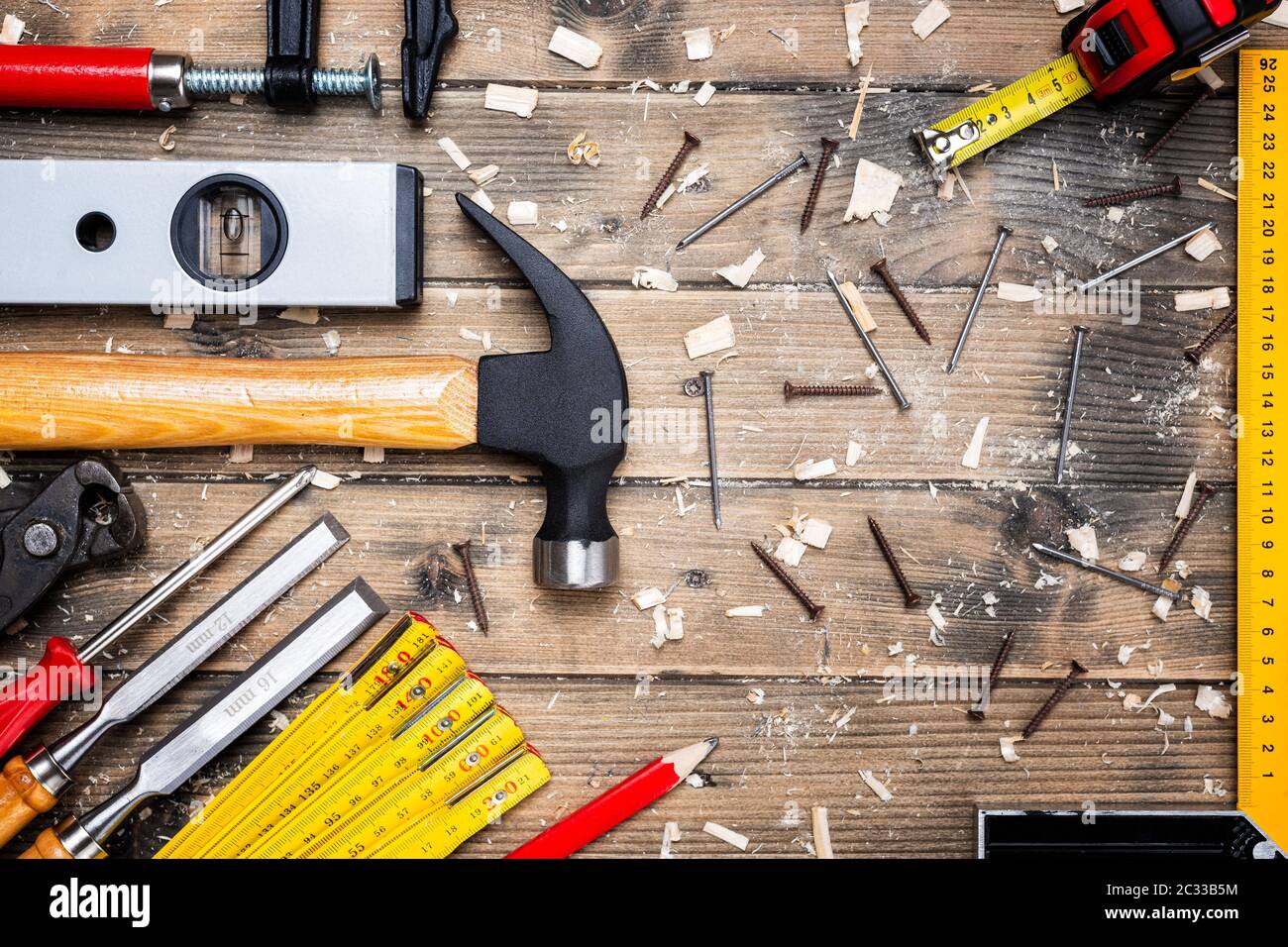 Top view of carpenter's tools on an antique wooden table. Construction ...