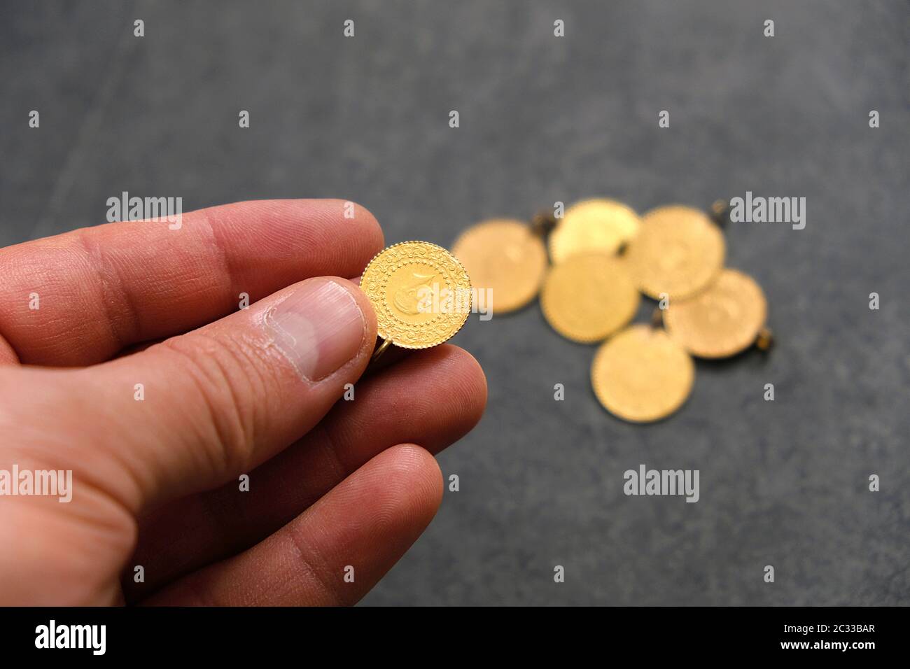 There's gold in the hands of a human, gold coins, gold lira turkey ...