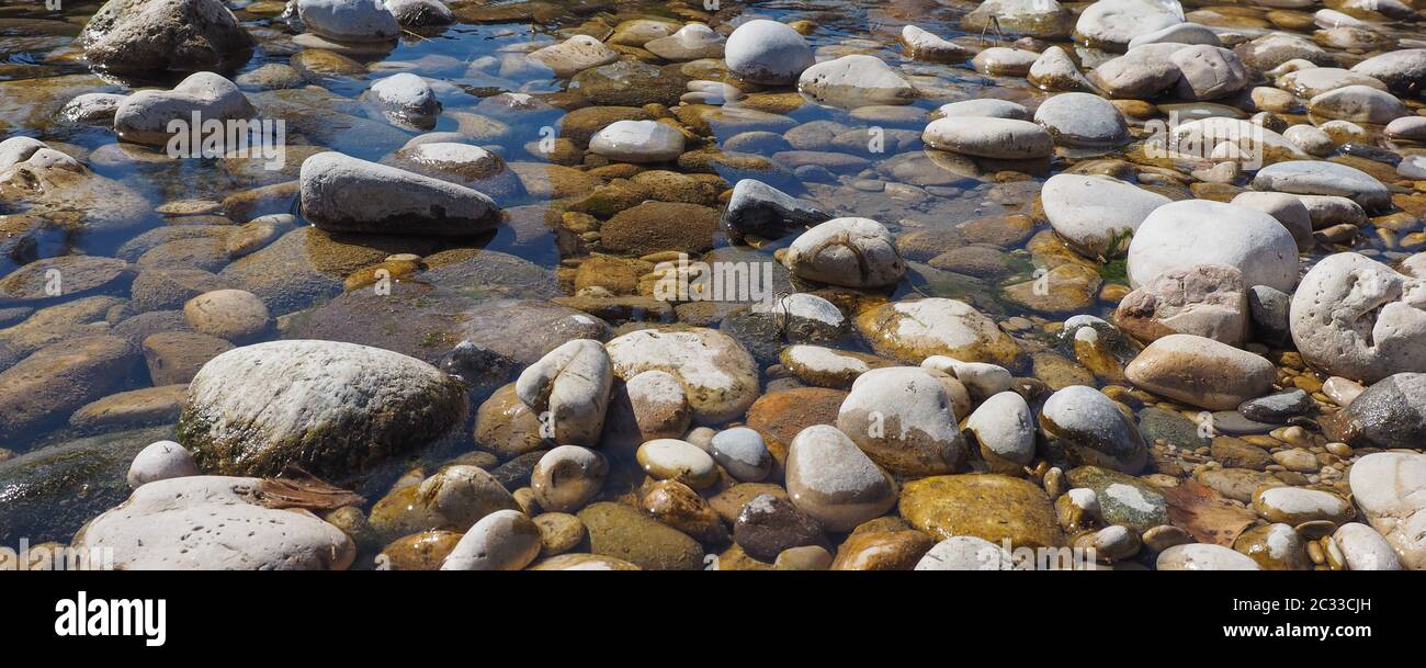 wide cobble and water texture useful as a background Stock Photo - Alamy