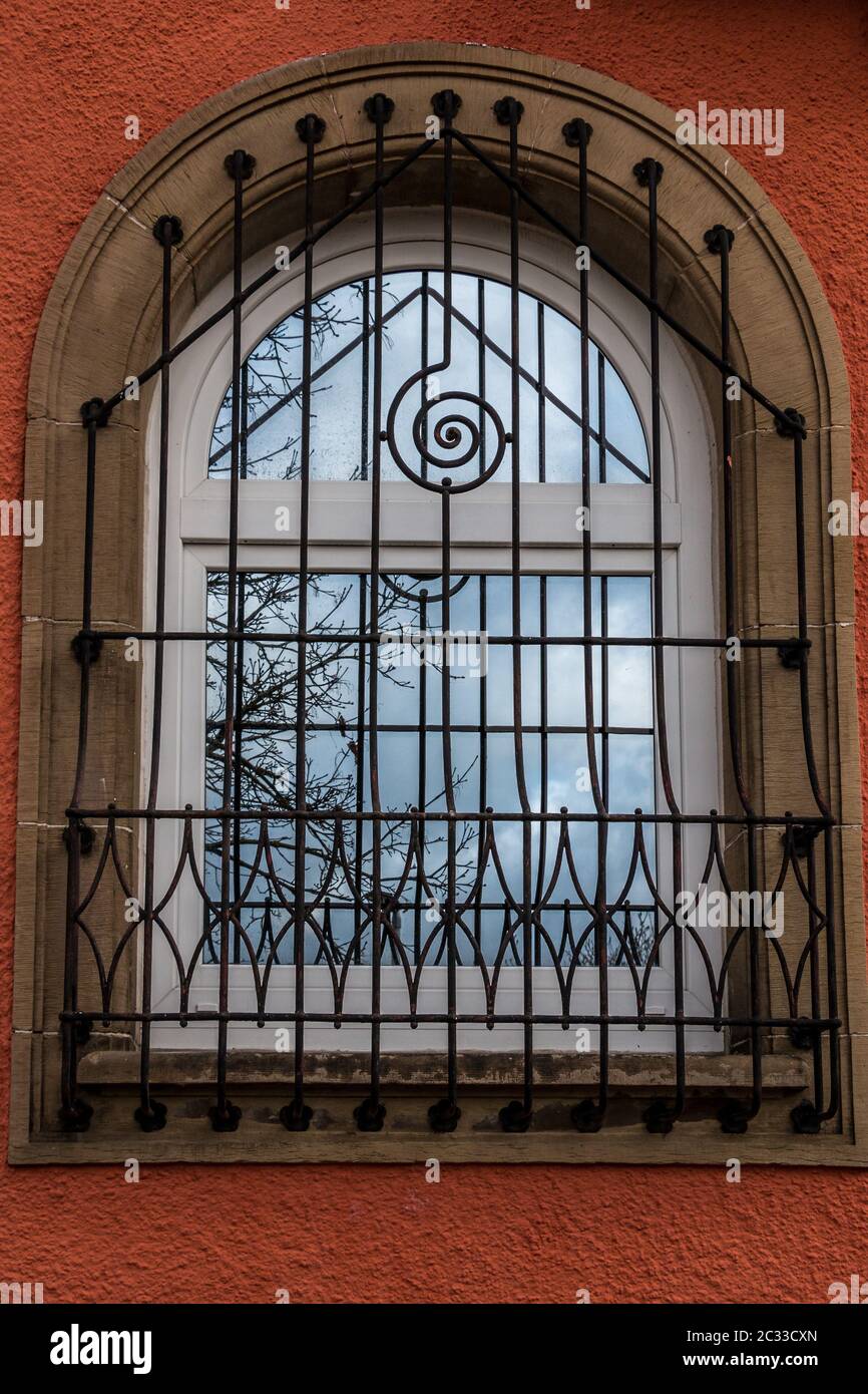 Window of a historical building with iron grid Stock Photo - Alamy