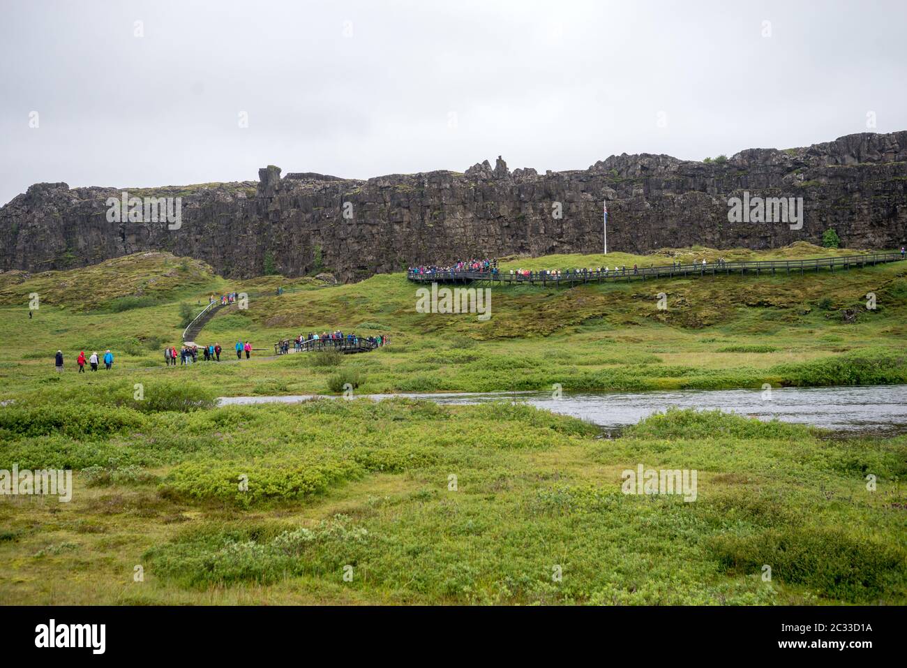 Thingvellir, Iceland - July 19, 2017: Tourists walk through the ...