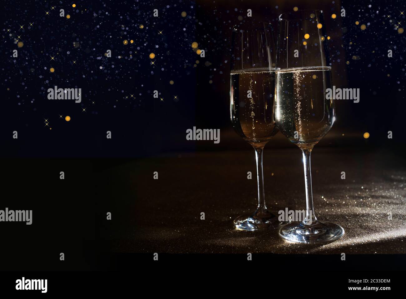 Sparkling champagne on abstract dark starry sky for new year greetings ...
