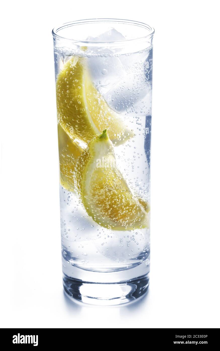 A Glass Of Sparkling Water With Lemon Isolated On White Stock Photo - Alamy