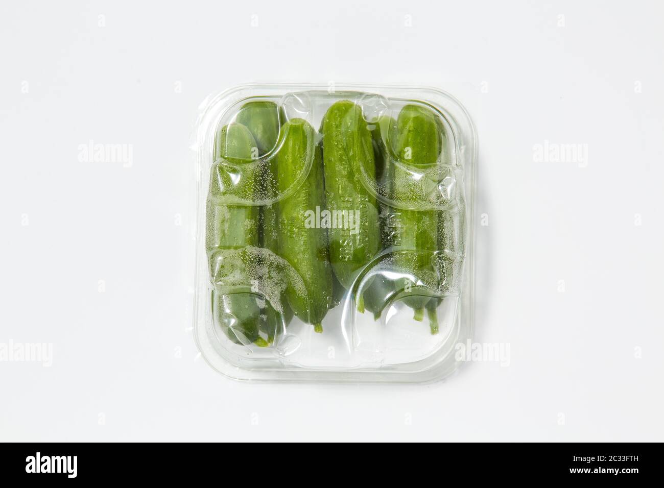Some cucumber in plastic packaging Stock Photo - Alamy