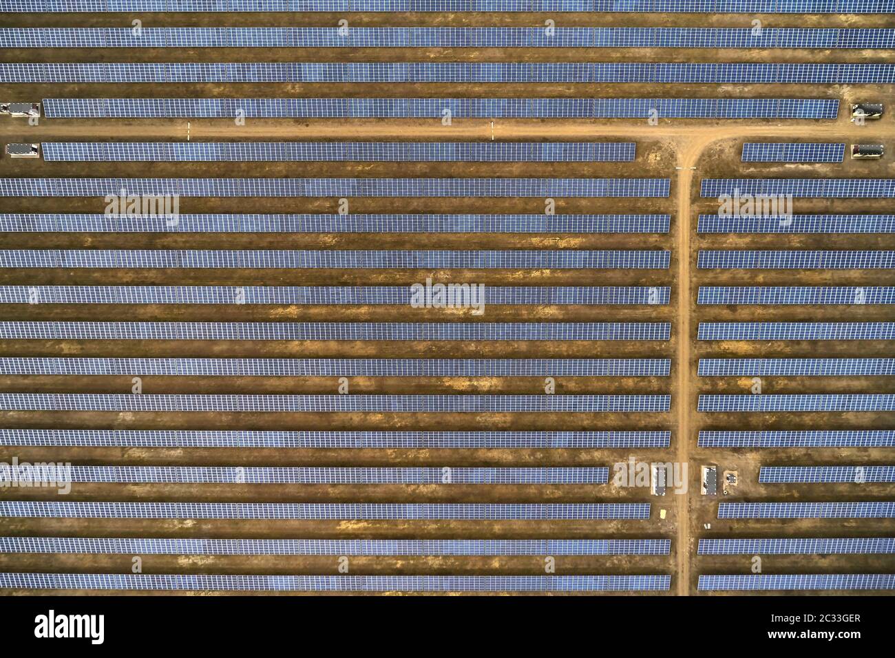 Solar panels in a large cluster forming solar power plant, top down ...