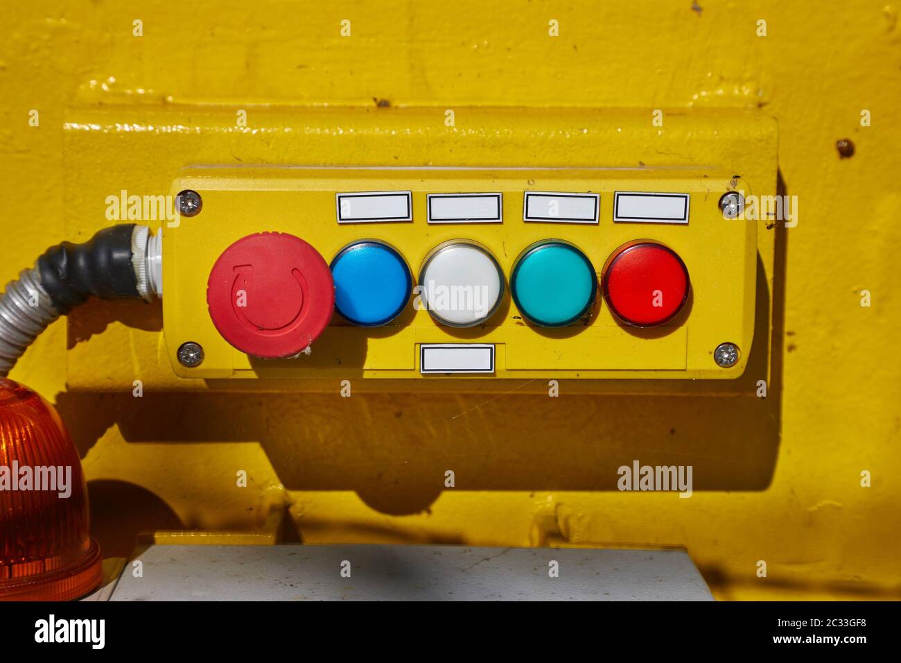 Industrial control panel in a factory, starting buttons of machines ...