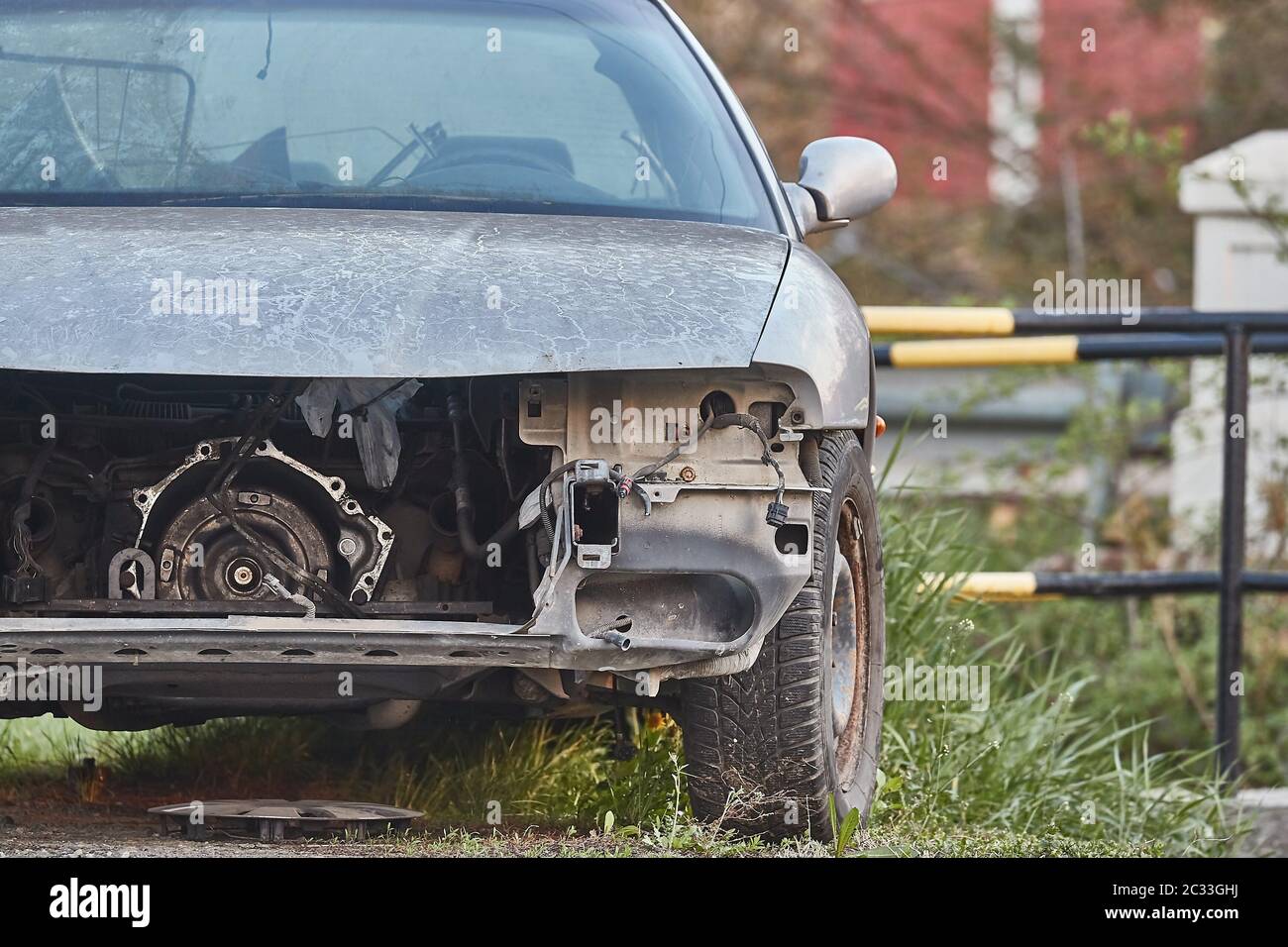 Front part of a wrecked car wreck with missing engine Stock Photo - Alamy