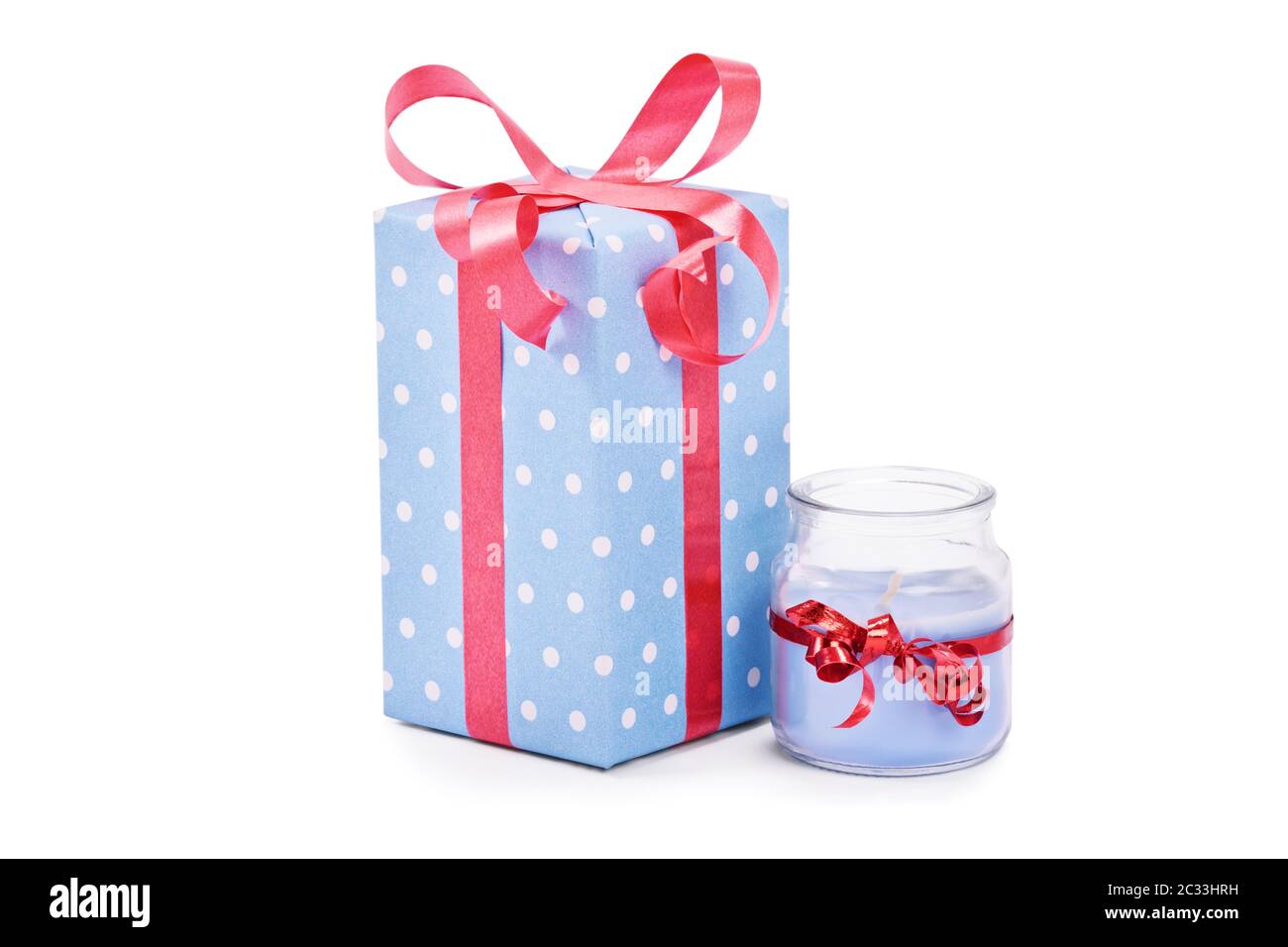 Cutely wrapped gift and candle, isolated on white background Stock ...