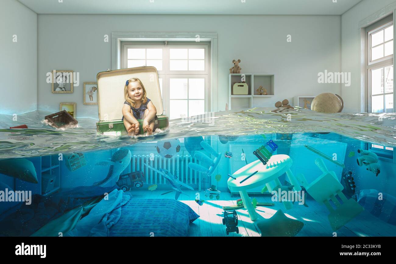 3 year old blond girl sitting inside a vintage suitcase floats on water in her flooded bedroom ...