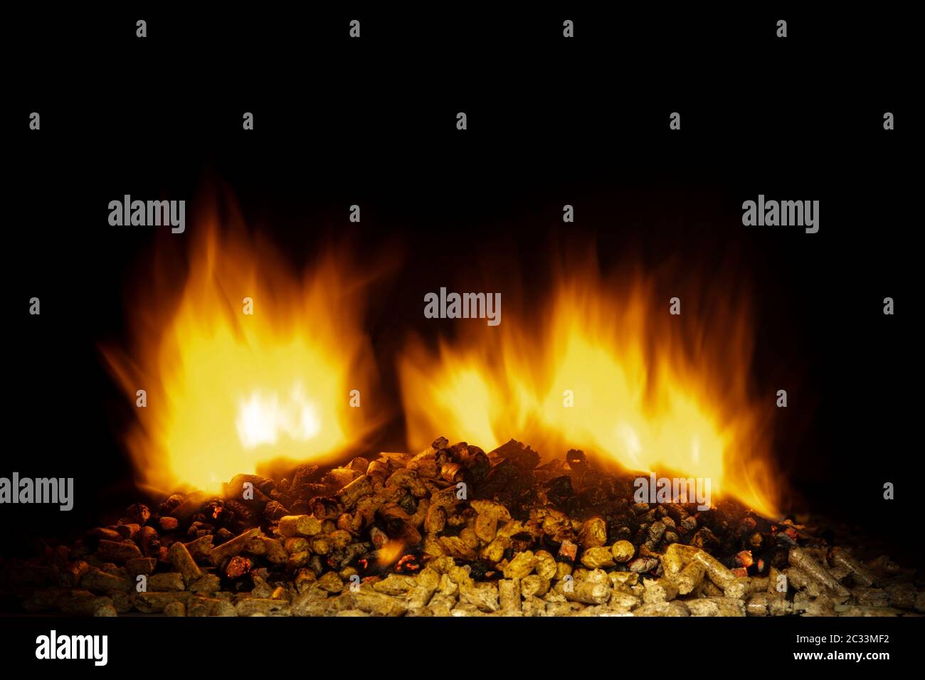 detail of wood pellets burning in a stove. Concept of heating and ...