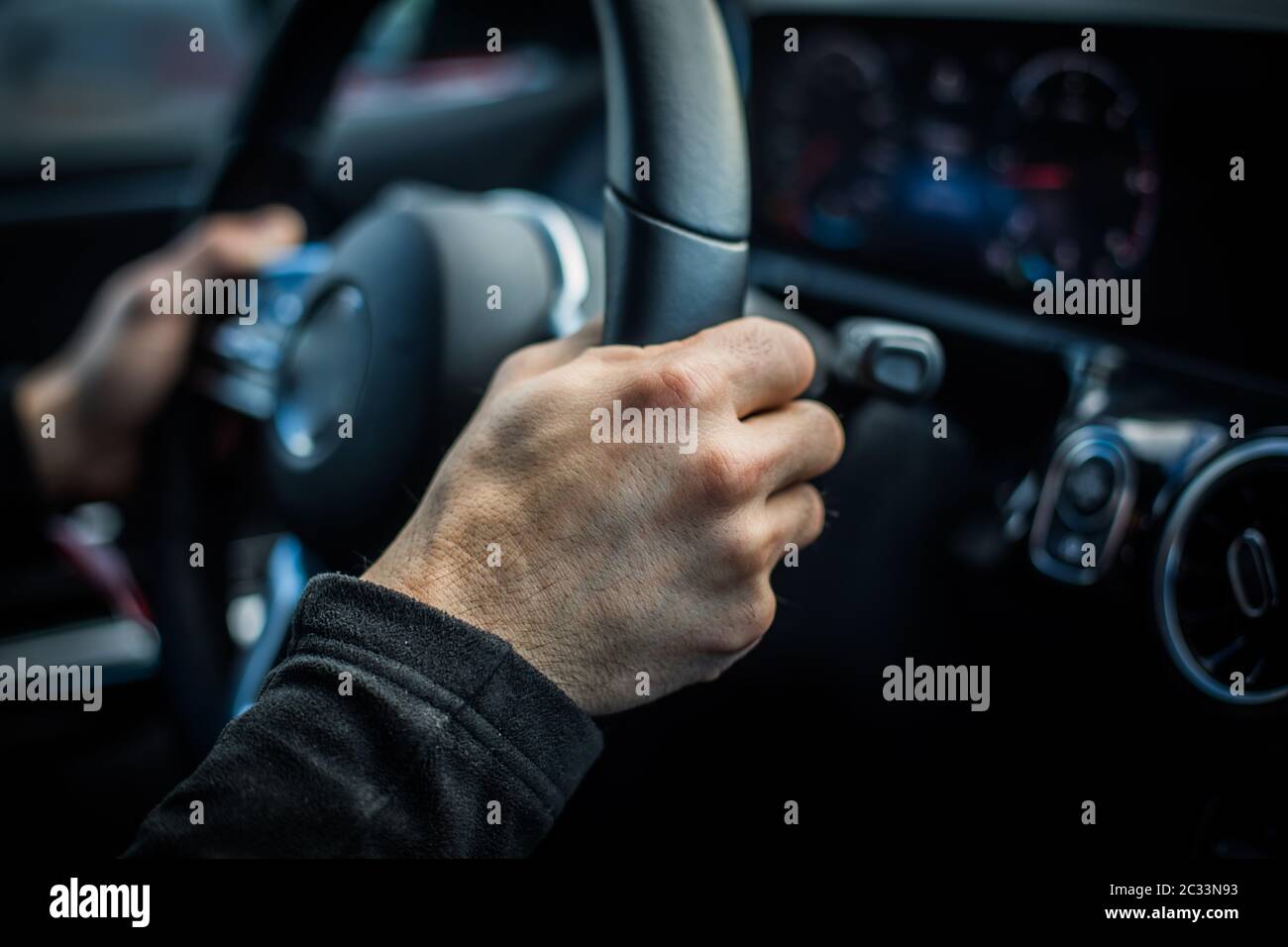Mans hand steering wheel hi-res stock photography and images - Alamy