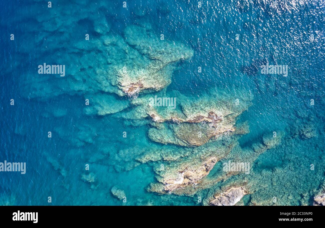 Aerial view on underwater reefs in mediterranean sea with clear ...