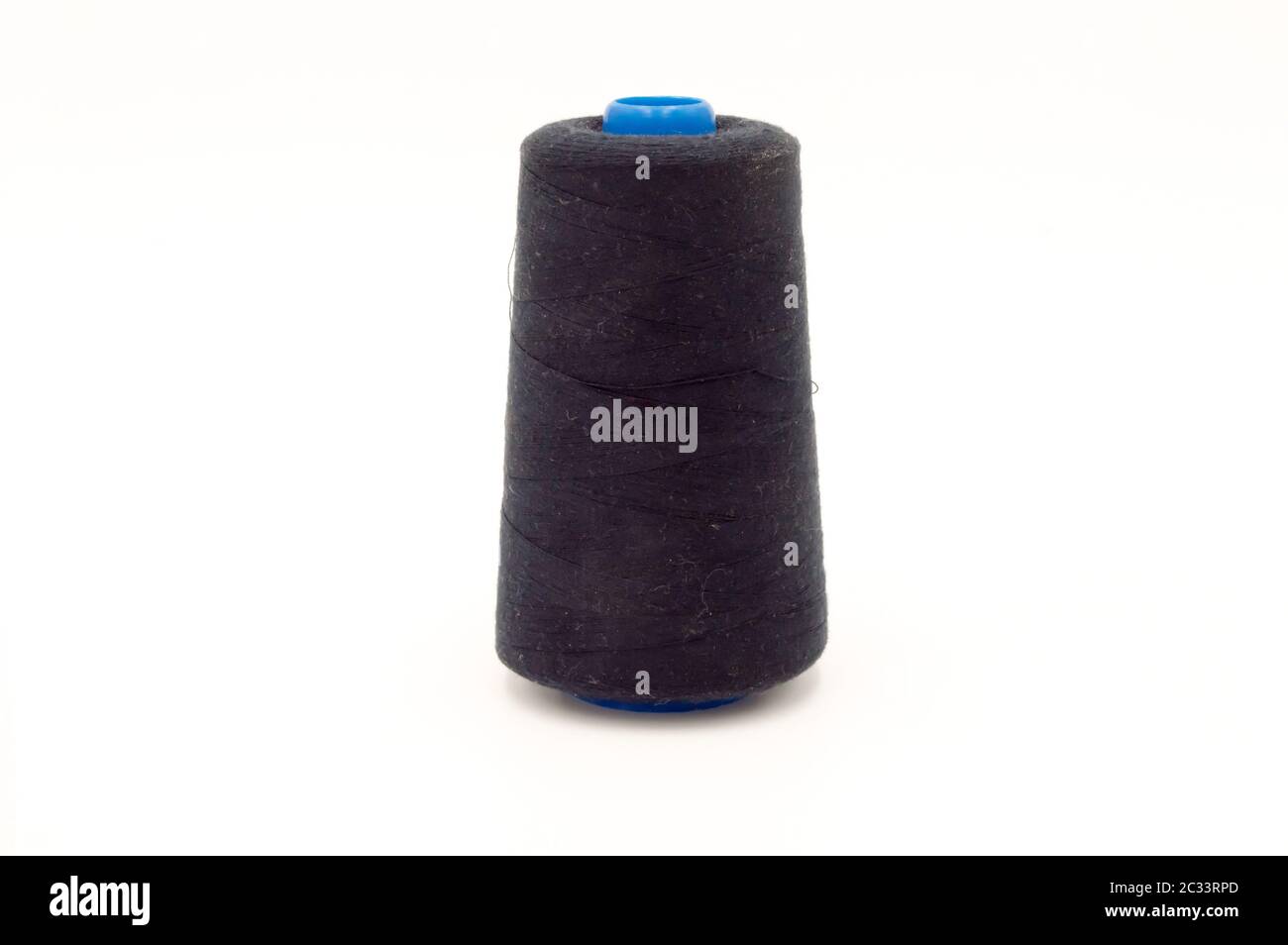 Close up of spool of colored thread on white background Stock Photo - Alamy