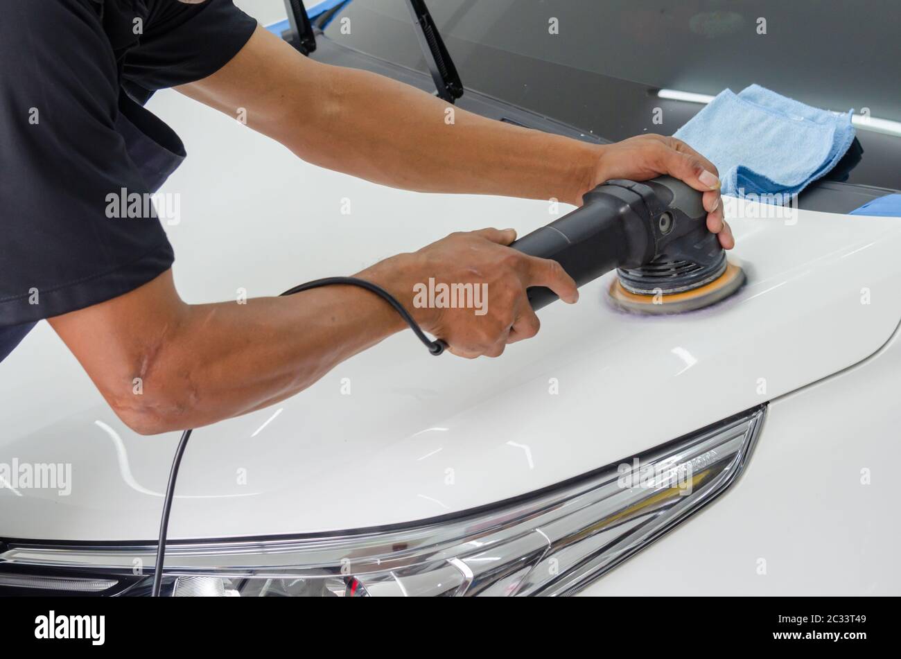 Man hands holding the work tool polish the car.Buffing and polishing ...
