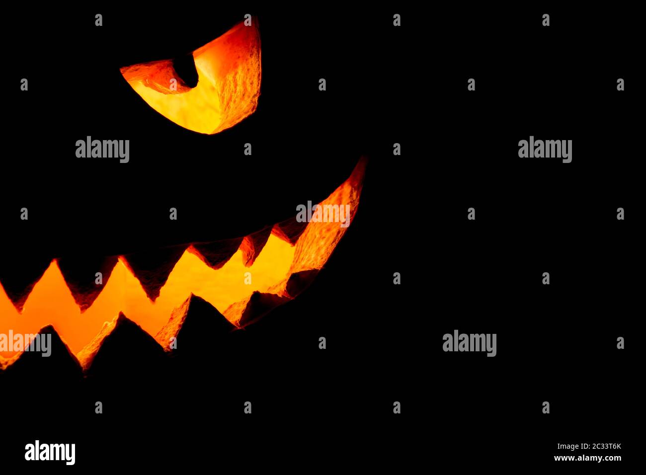 Big spooky helloween symbol has a glowing mad face and smiling with ...