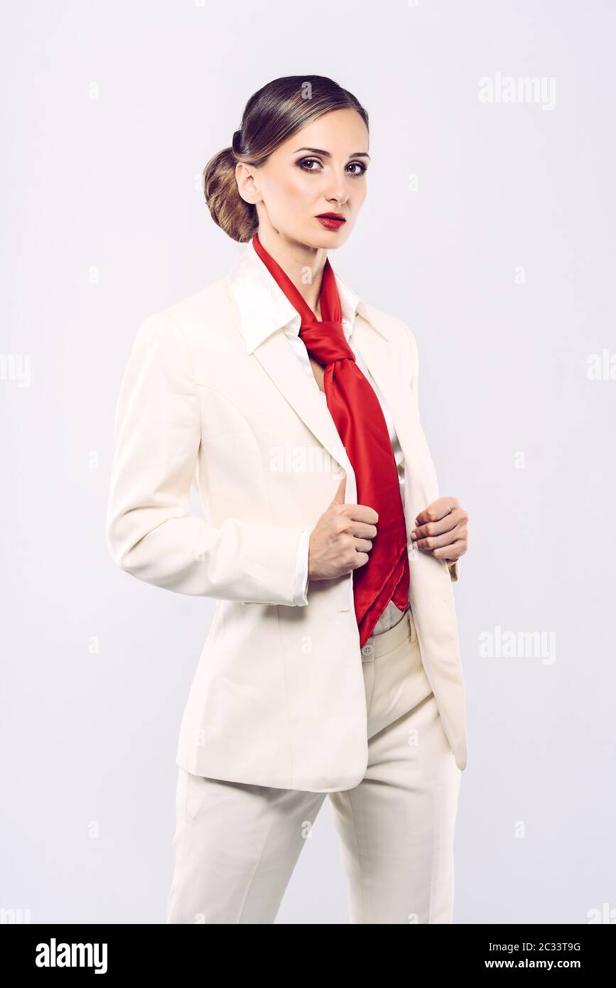 Elegant and expensive model wearing white business suit in studio shot ...