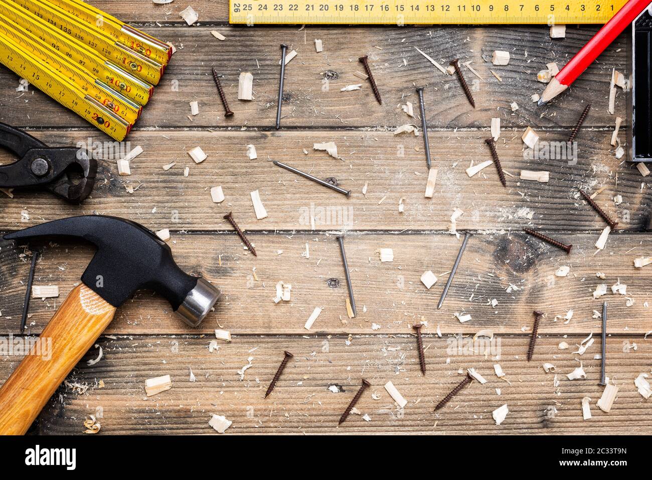 Top view of carpenter's tools on an antique wooden table. Construction ...