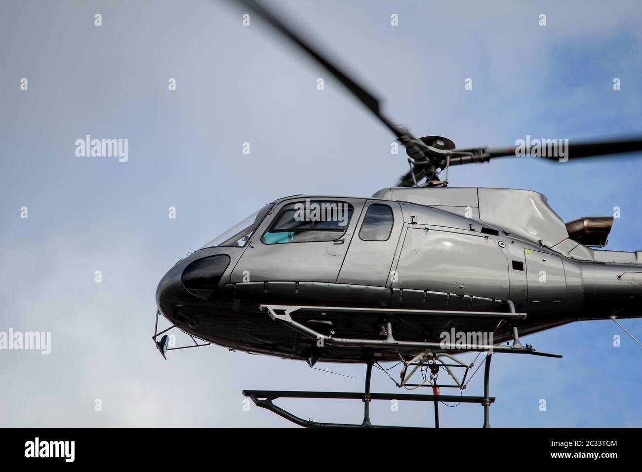 A cargo helicopter on the railway construction site KÃ¶then, mast ...