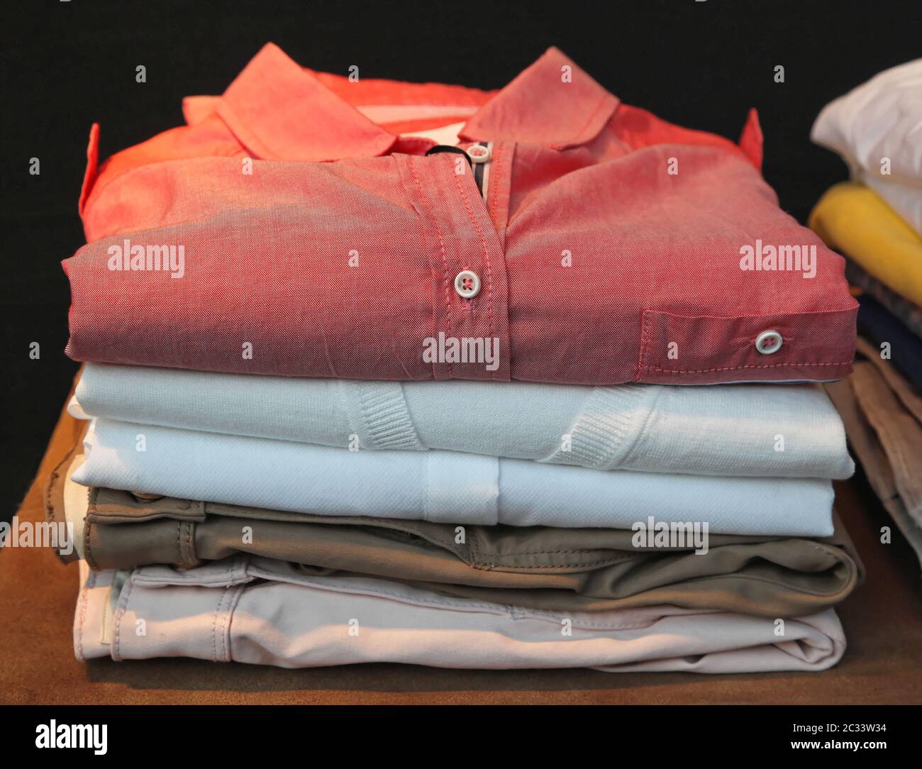 Stack of clean modern clothes Stock Photo - Alamy