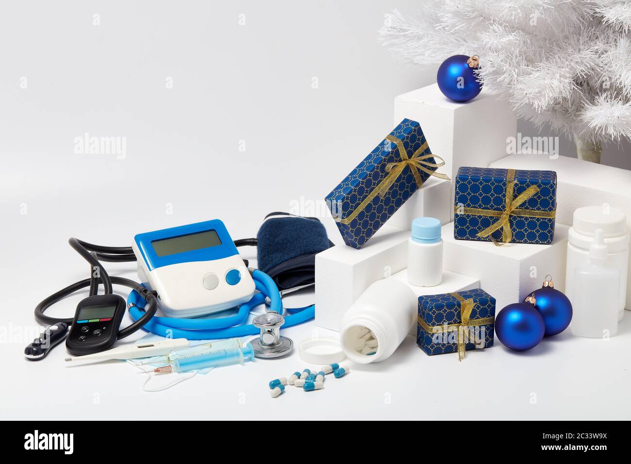Stethoscope, medical devices, white fir tree, gift boxes and Christmas ...