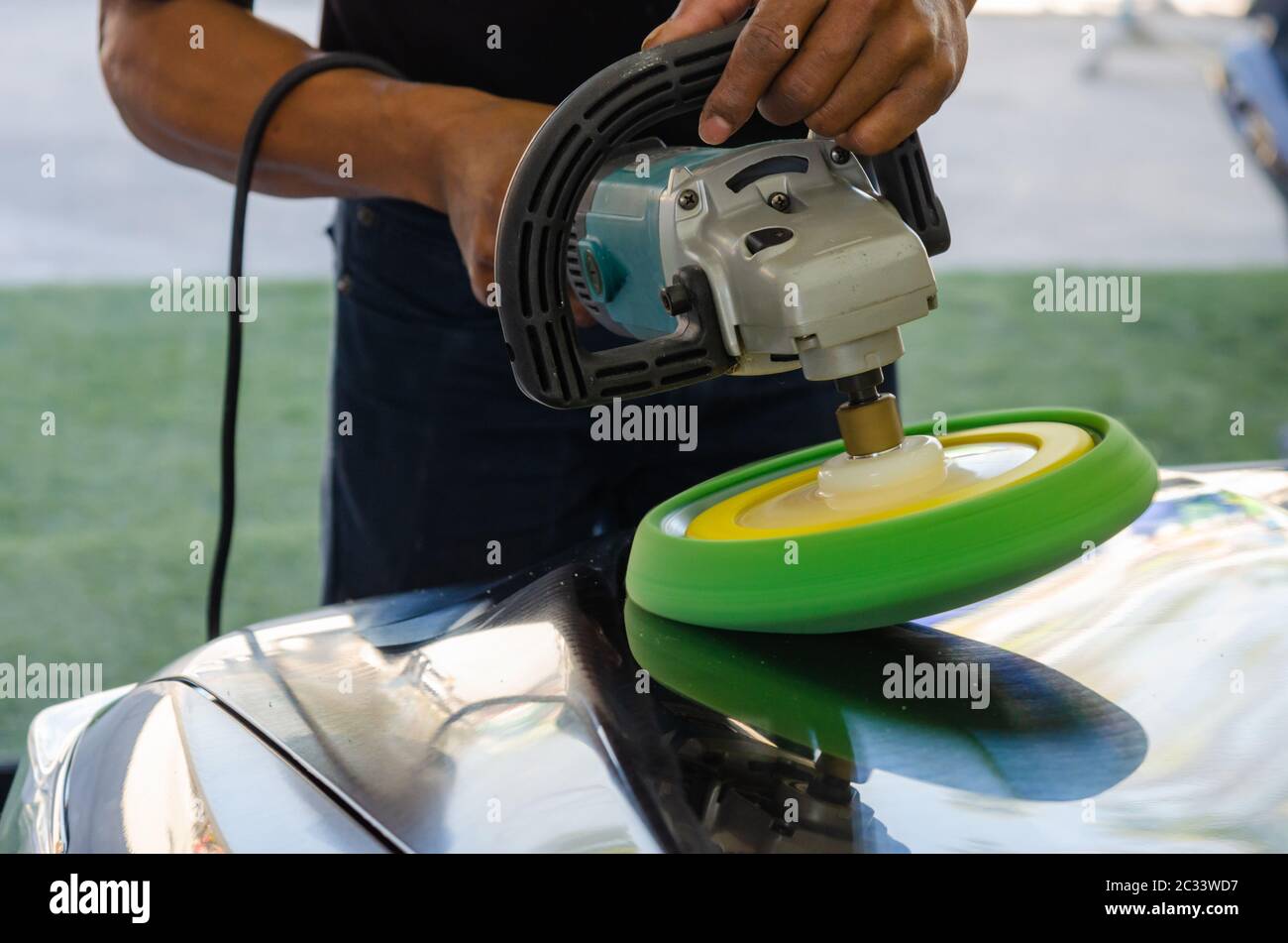Man hands holding the work tool polish the car.Buffing and polishing ...