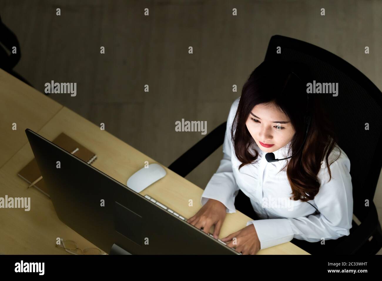 Call center working top view night Stock Photo - Alamy