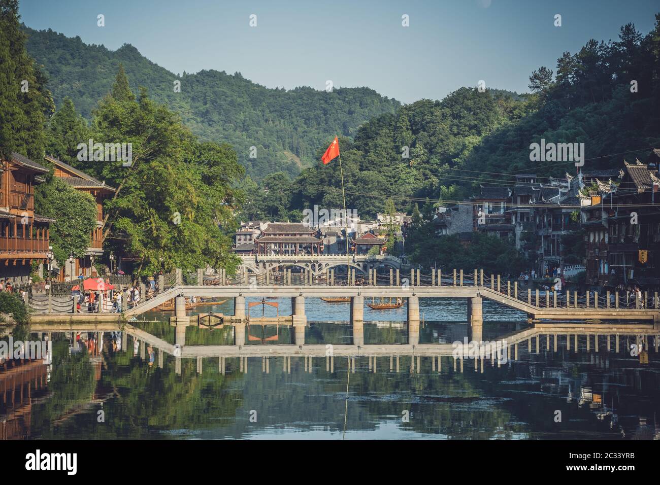 Chinese flag over bridge in Feng Huang Stock Photo - Alamy