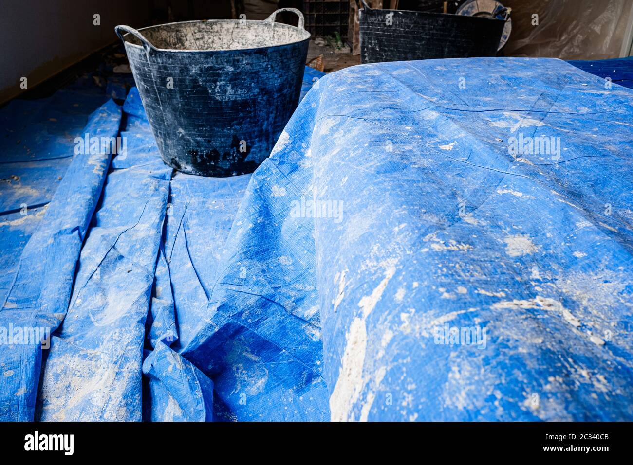 Dirty buckets and used with cement by bricklayers during a botched ...