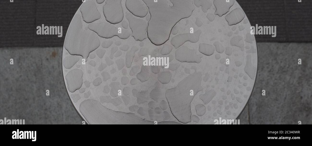 wide wet grey steel texture with droplets of water useful as a ...