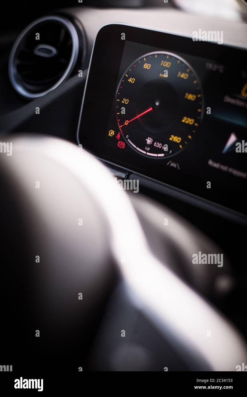 Close up shot with the digital speedometer on a modern car dashboard ...